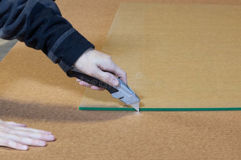 Warehouse Worker Using a Box Cutter Closeup Stock Photo - Image of ...
