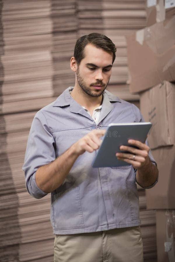 Manager Using Tablet Computer in Distribution Warehouse Stock Image ...