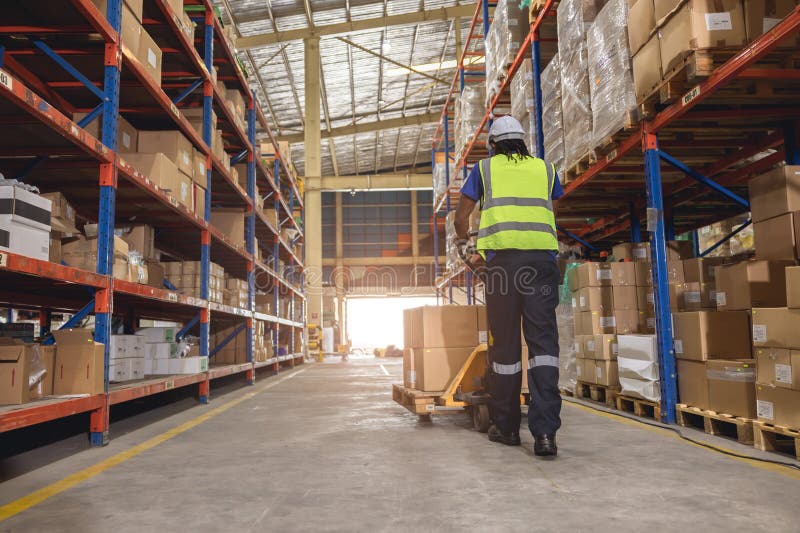 Warehouse Worker Using Hand Pallet Trucks Loading Cargo for Shipping ...