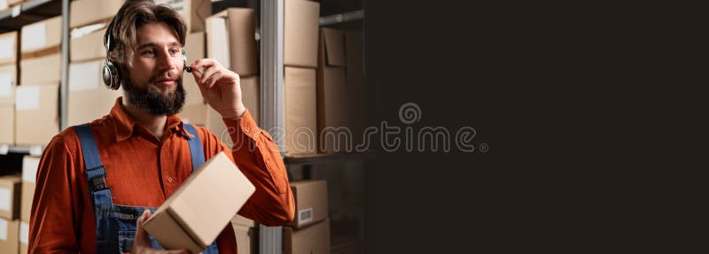 Warehouse Worker Using Headset Holding Package for Delivery To Customer ...