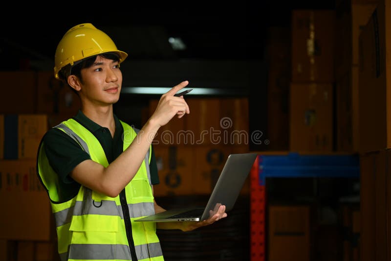 Warehouse Worker Using Laptop, Checking Quantity of Storage Product in ...