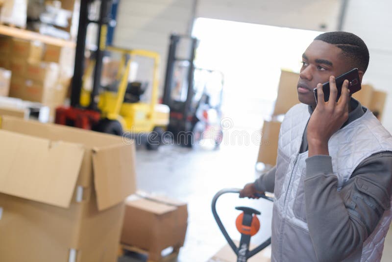 Warehouse Worker Using Mobile Phone Stock Image - Image of factory ...