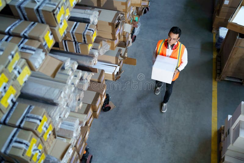 Warehouse Worker Walks with a Box. Stock Photo - Image of employee ...