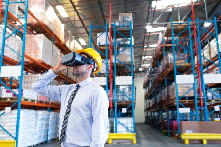 Warehouse Worker Wearing VR Headset and Hard Hat Exploring Virtual ...