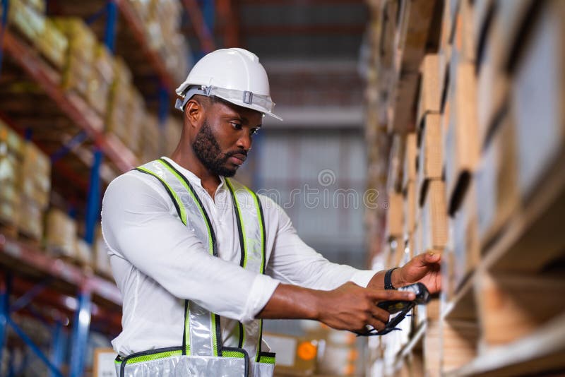 Warehouse Worker Working Process Checking the Package with a Tablet in ...