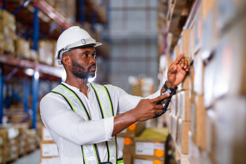 Warehouse Worker Working Process Checking the Package with a Barcode ...