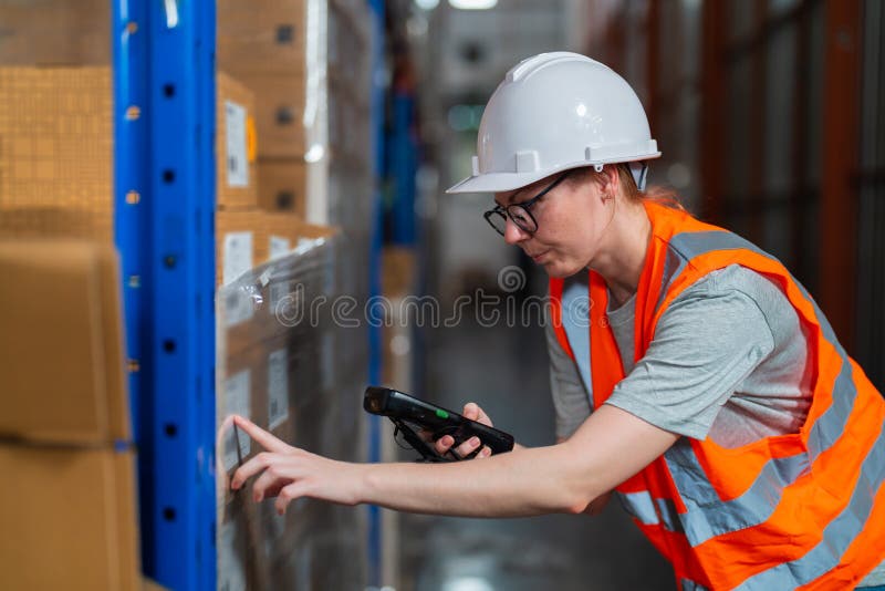 Warehouse Worker Working Process Checking the Package Using Laptop in ...