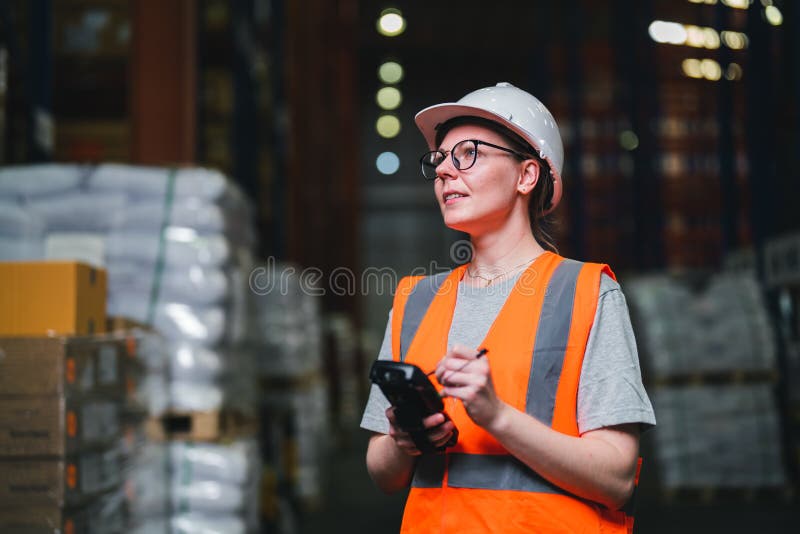 Warehouse Worker Working Process Checking the Package Using a Tablet in ...