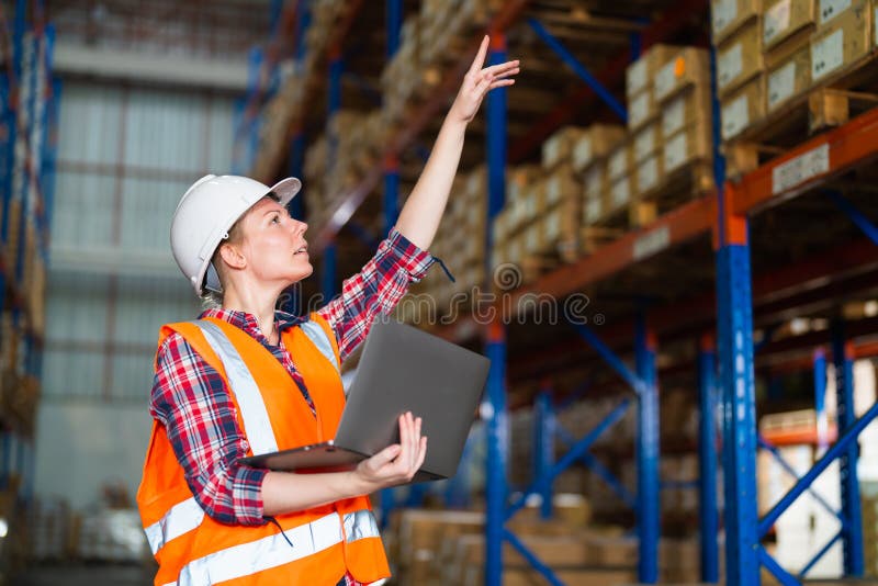 Warehouse Worker Working Process Checking the Package Using a Tablet in ...