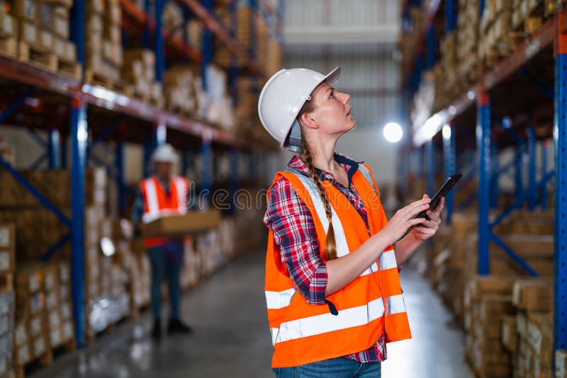 Warehouse Worker Working Process Checking the Package Using a Tablet in ...