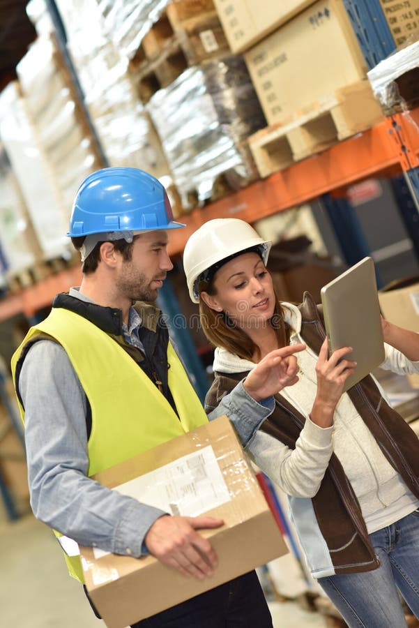 Warehouse Workers Checking on Goods Stock Photo - Image of boxes ...