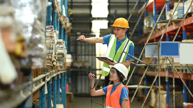 Warehouse Workers Checking Inventory Boxes with Barcode Scanner on ...