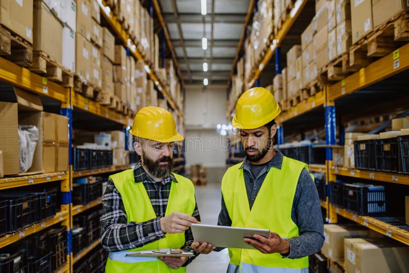 Warehouse Workers Checking Stuff in Warehouse with Digital System in ...