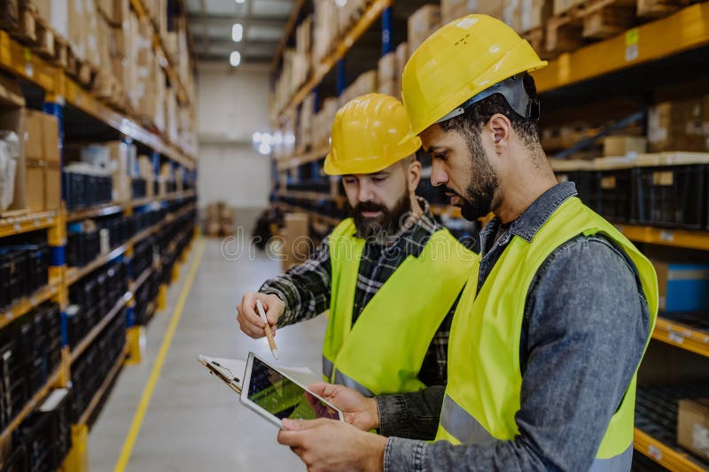 Warehouse Workers Checking Stuff in Warehouse with Digital System in ...