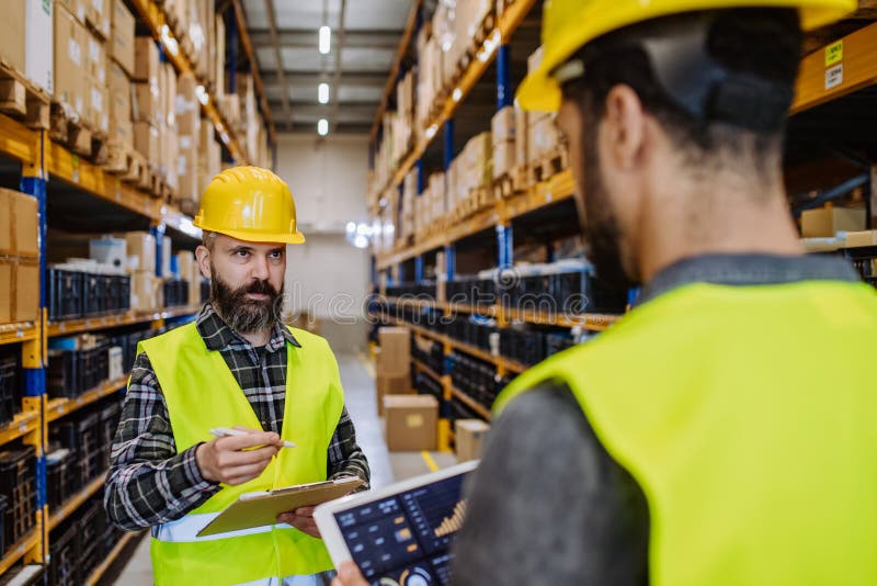 Warehouse Workers Checking Stuff in Warehouse with Digital System in ...