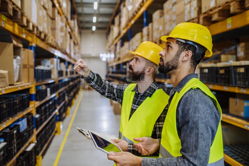 Warehouse Workers Pulling a Pallet Truck. Stock Image - Image of ...