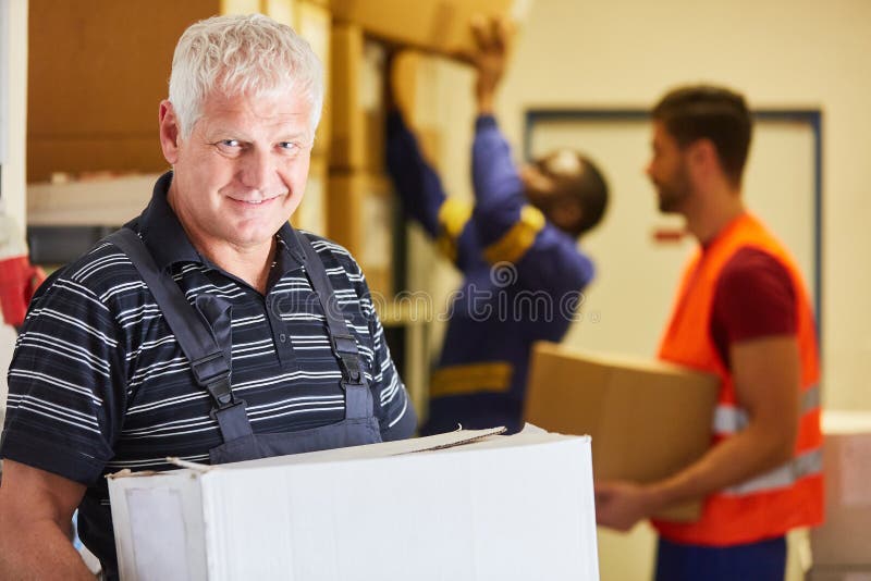 Warehouse Workers and Colleagues Carry Cardboard Boxes Stock Photo ...