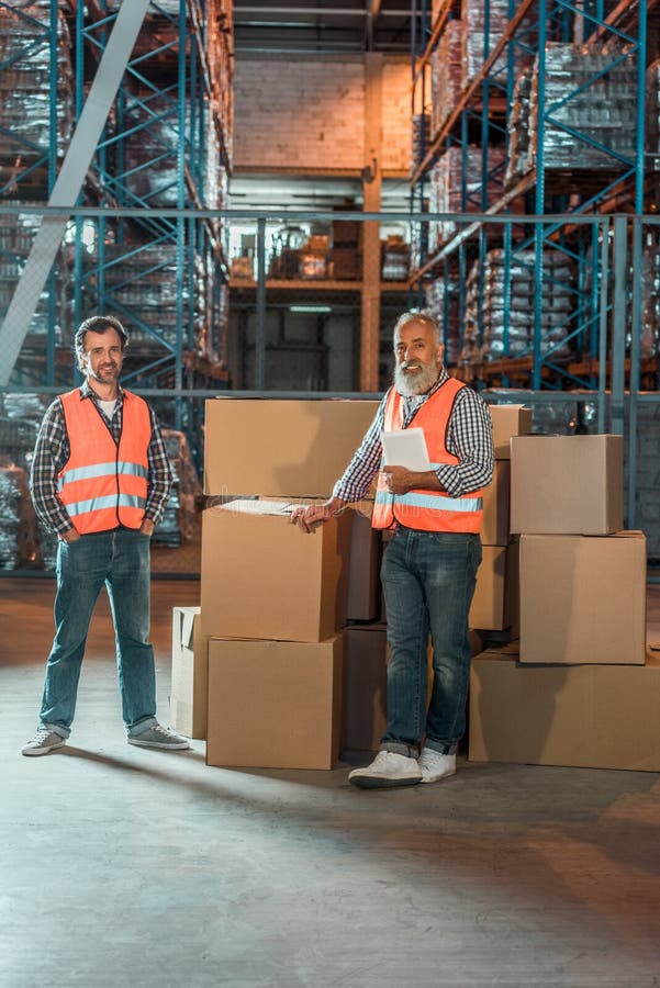 Two Male Warehouse Workers with Digital Tablet Smiling Stock Photo ...