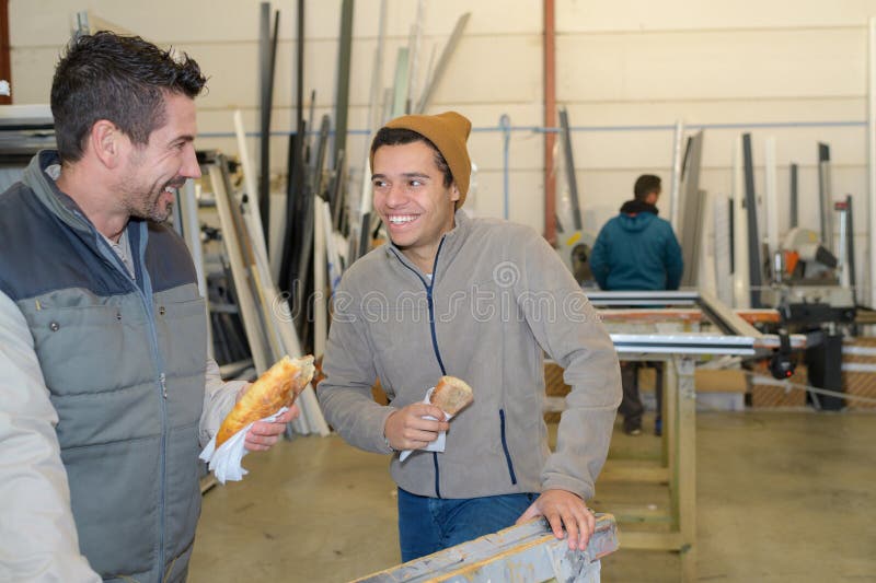 Warehouse Workers Eating Sandwiches during Lunchbreak Stock Photo ...