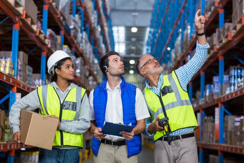 Warehouse Workers Interacting with Each Other Stock Image - Image of ...