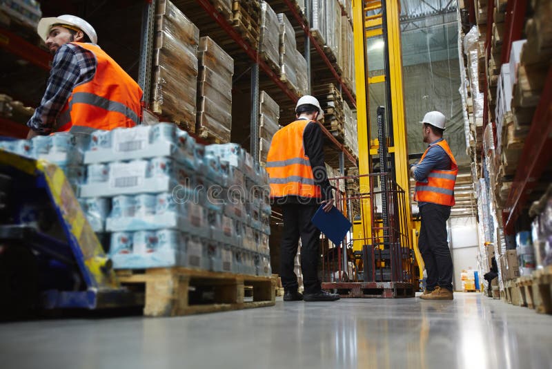 Warehouse Workers Loading Goods on Reach Fork Truck Stock Photo - Image ...