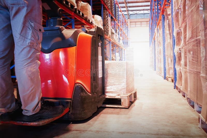 Warehouse Workers Loading a Package Boxes Pallets at Warehouse. Supply ...