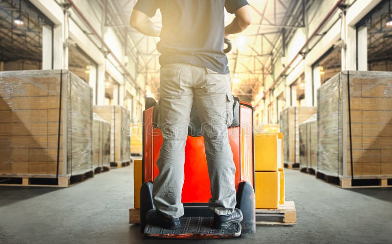 Warehouse Workers Loading a Package Boxes Pallets at Warehouse. Supply ...