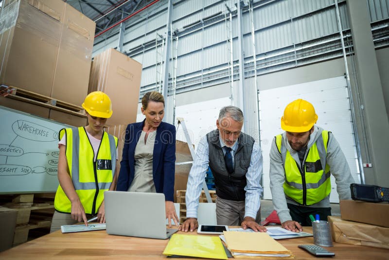 Warehouse Workers and Managers Interacting with Each Other Stock Image ...