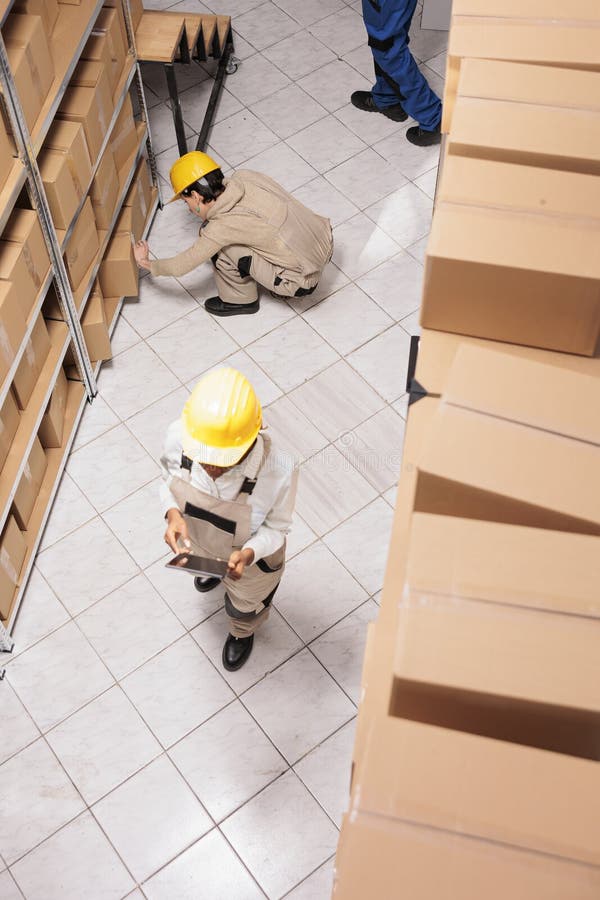 Warehouse Workers Packing Customer Order Package with Adhesive ...