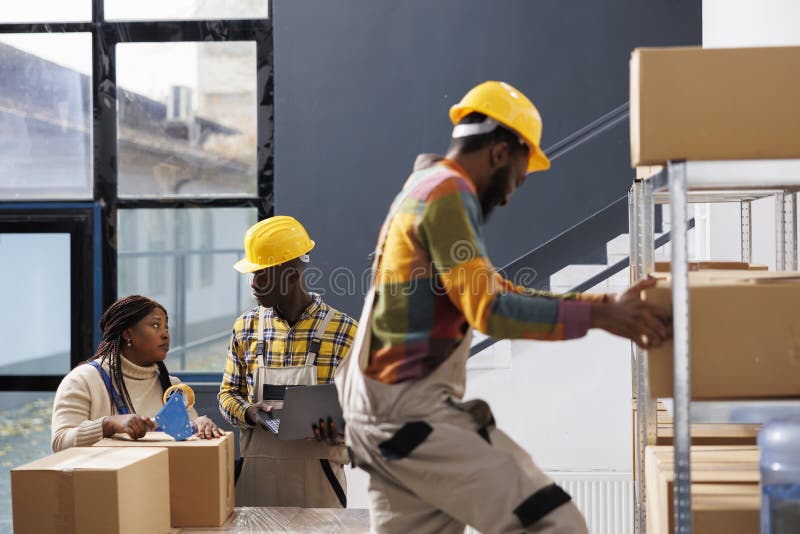 Warehouse Workers Packing Customer Order Package with Adhesive ...