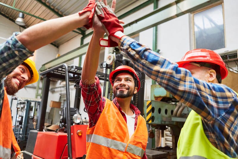 Warehouse Workers in Warehouse Make High Five for Motivation Stock ...
