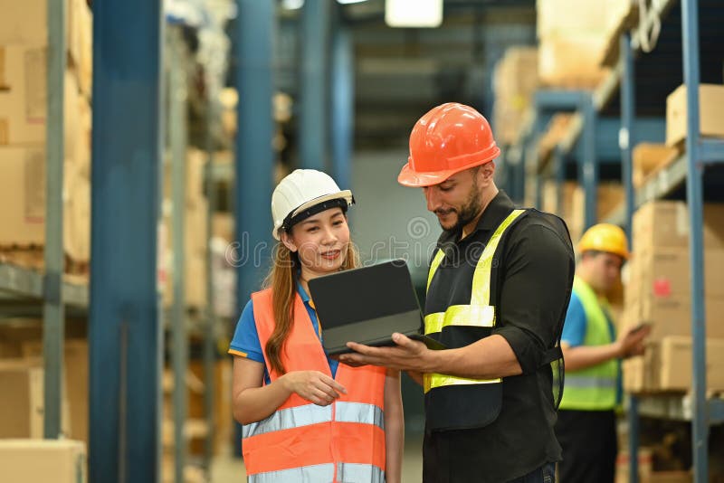 Warehouse Workers Wearing Safety Hardhat Working on Retail Warehouse ...