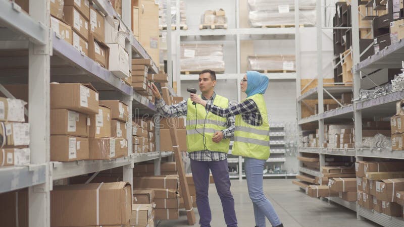 Warehouse Workers Communicate and Carry Out Accounting Scanner Barcode ...