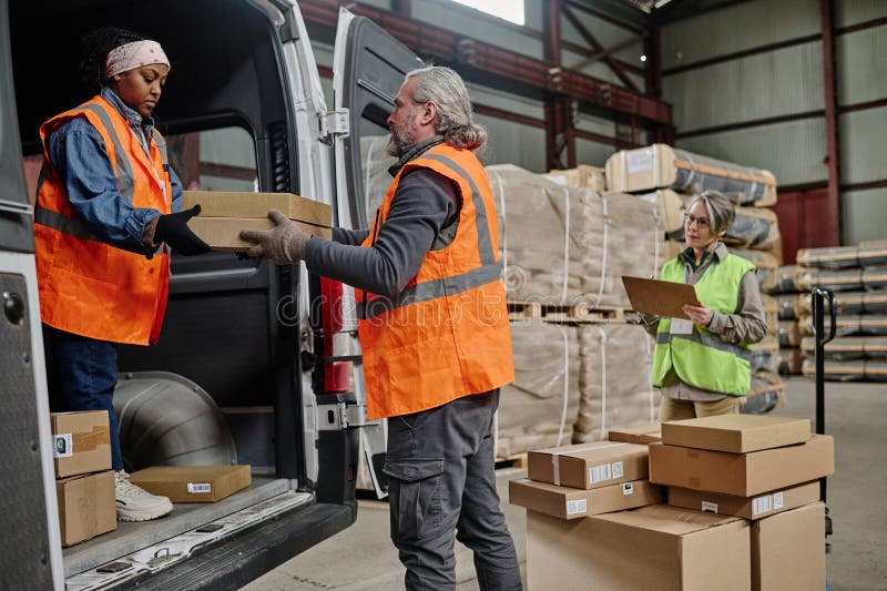 Warehouse Workers Working in Team Stock Image - Image of cargo, vehicle ...