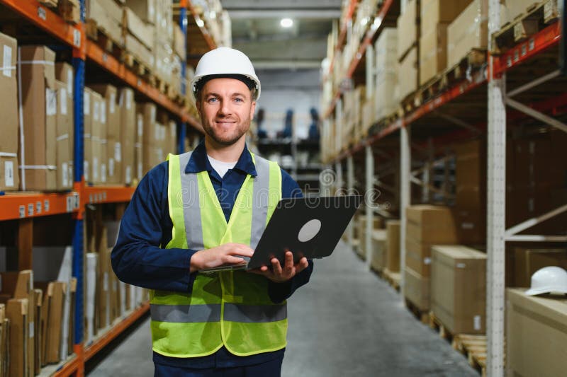 Warehouseman Checking Delivery, Stock in Warehouse on Laptop. Warehouse ...