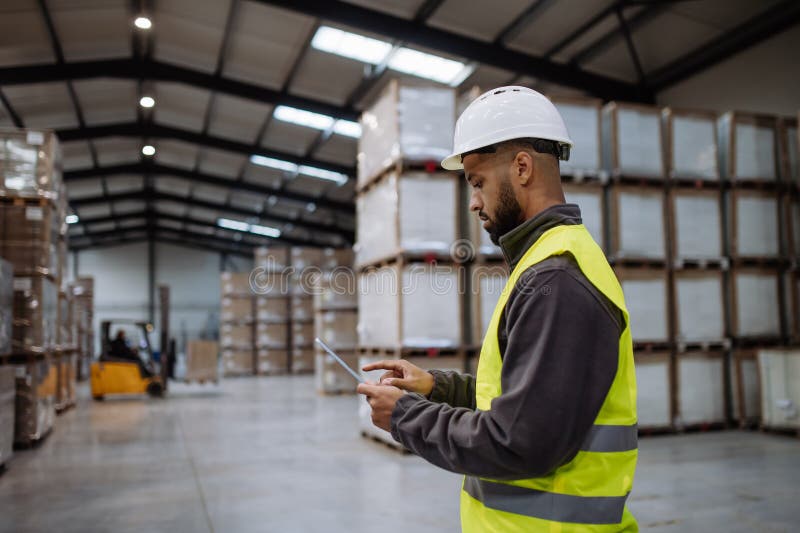 Warehouseman with Tablet Checking Delivery, Stock in Warehouse ...