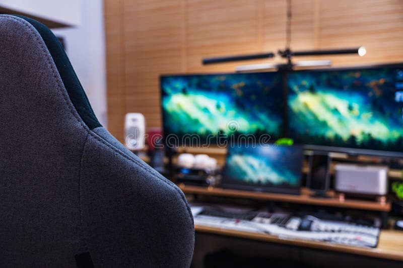 Warm and Blurred Desk Setup with Focus on Technology, Lighting, and ...