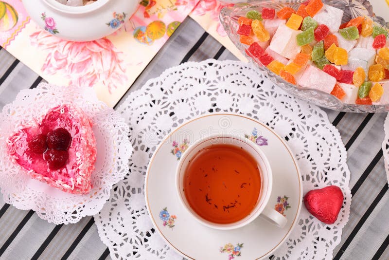 Warm cup of tea and sweets stock photo. Image of potion - 36769808