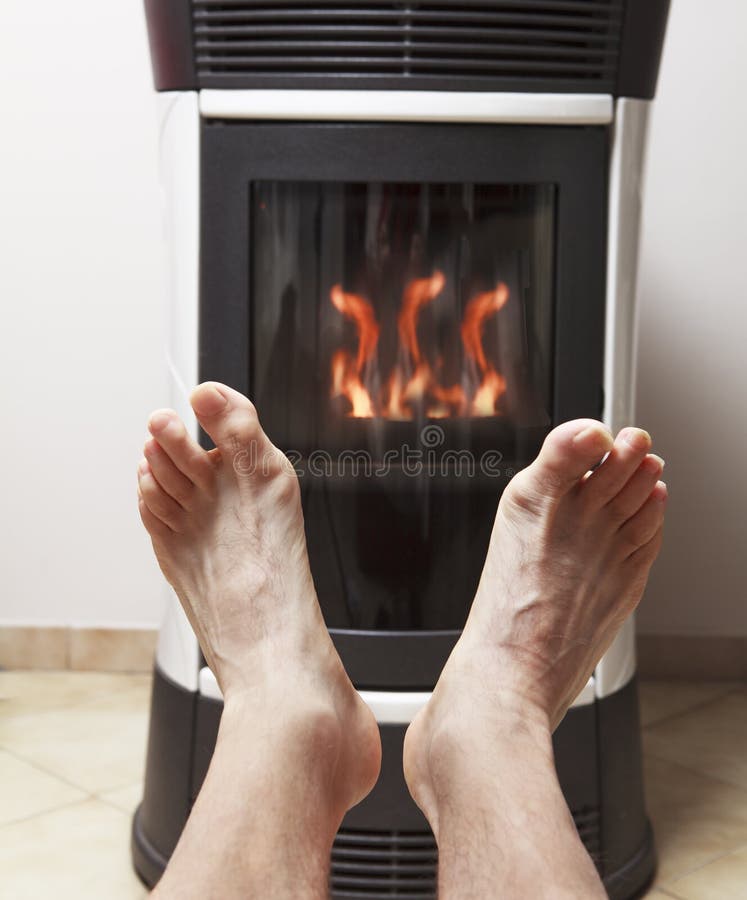 Warm feet in front of fire stock photo. Image of socks - 82591700