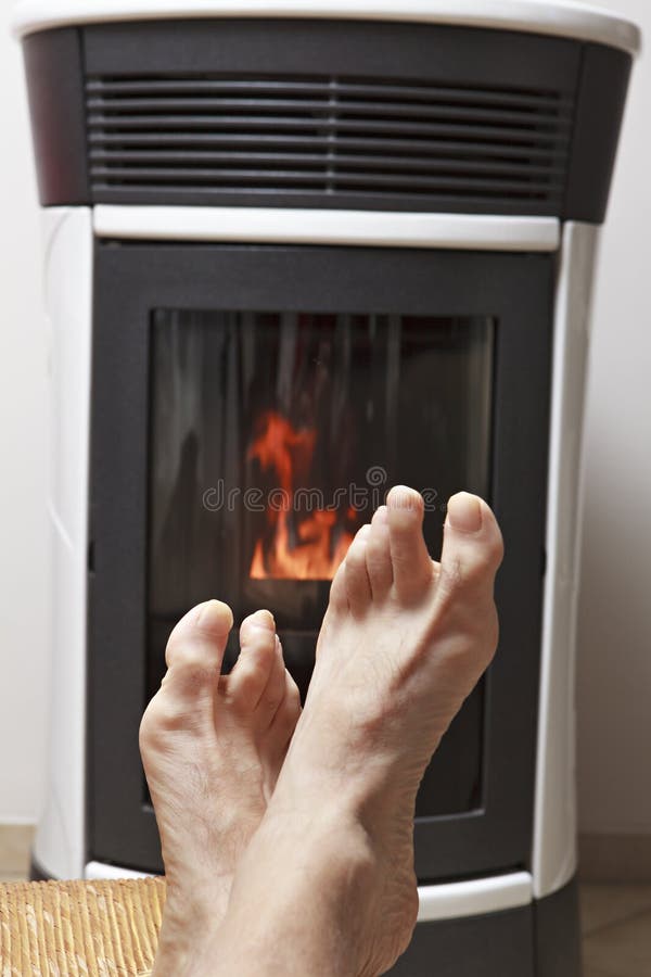 Warm feet in front of fire stock photo. Image of relaxing - 82589982