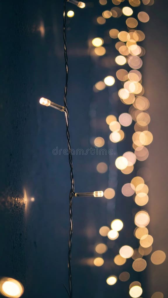 Warm Golden String Lights Bokeh Effect on a Blue Dark Textured ...