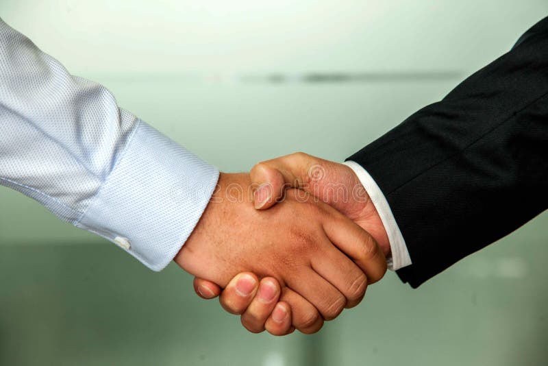 Warm handshake stock image. Image of friendship, dresses - 58200227