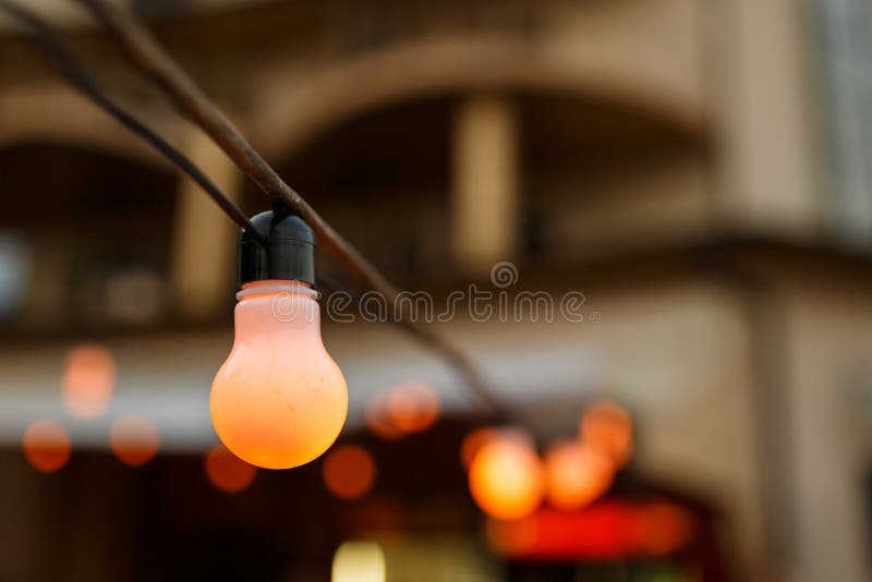 Warm Light Bulbs at the Evening Event Stock Photo - Image of blur, city ...