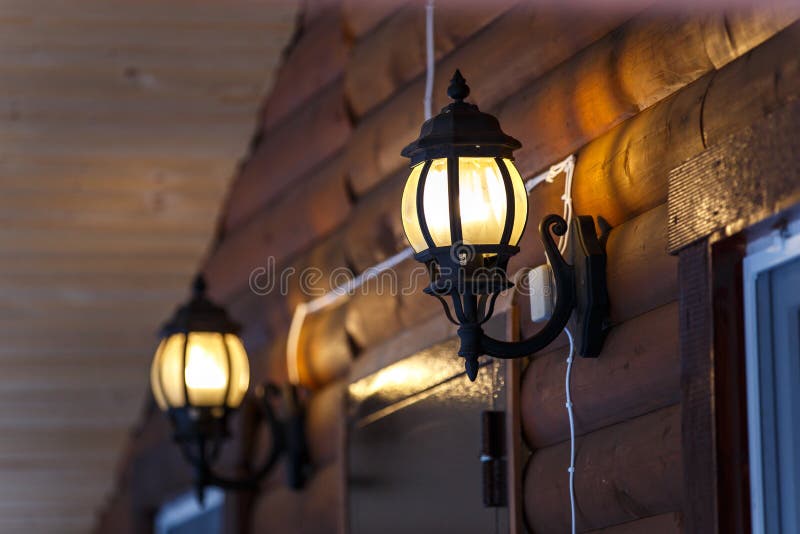 Warm Light of External Lamps on the House Wall Stock Photo - Image of ...