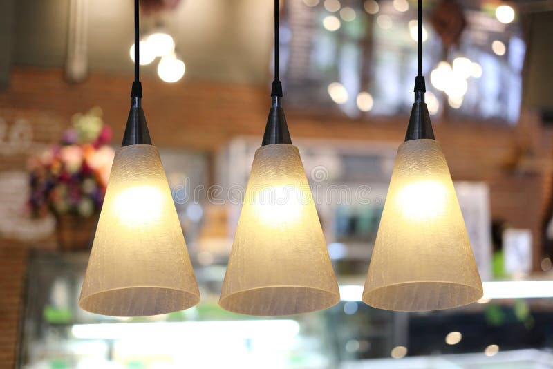 Warm Lighting Modern Ceiling Lamps in the Cafe. Stock Image - Image of ...