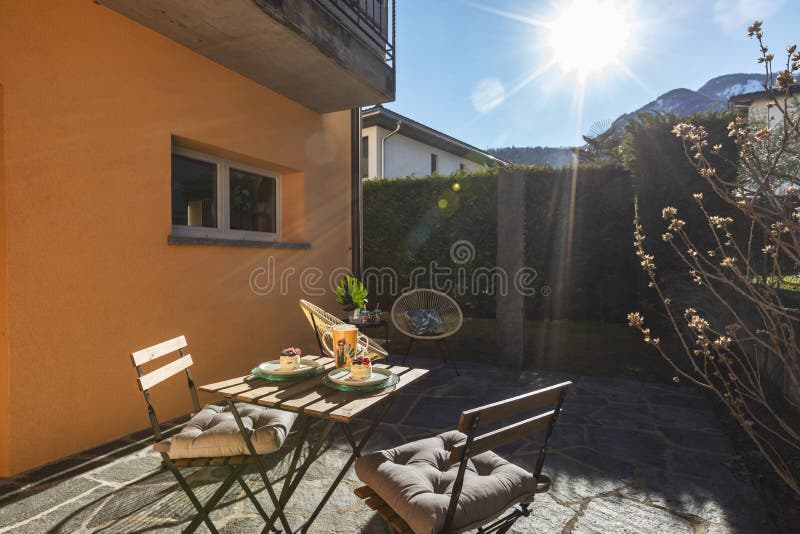 Warm Patio with Sun in Spring Day. Everything is Ready for a Intimate ...