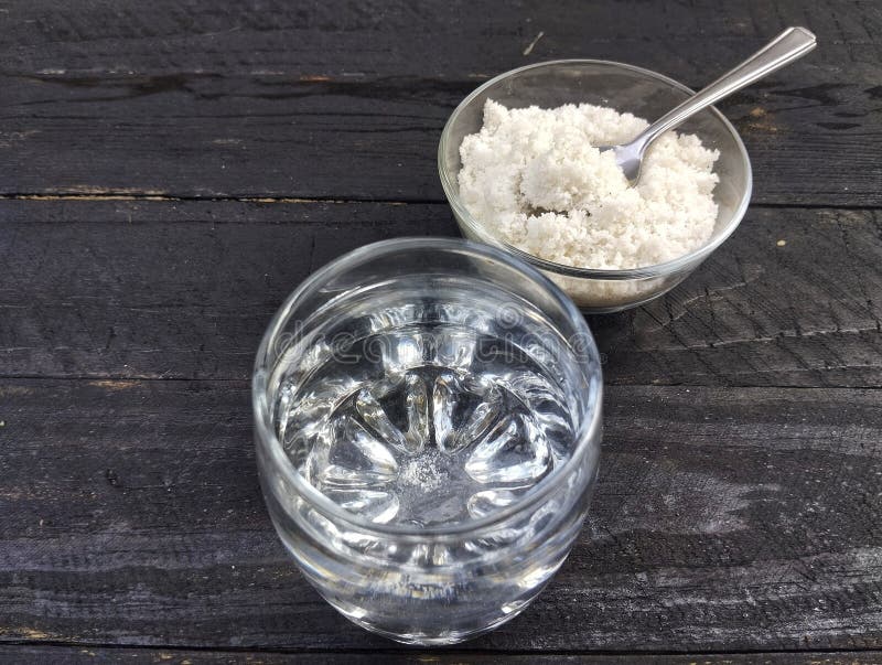 Warm Salt Water Solution on the Black Wood Stock Photo - Image of ...