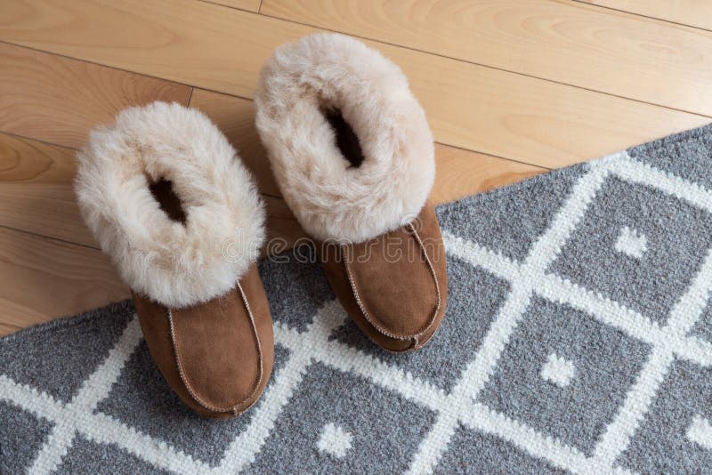 Warm slippers on a rug stock photo. Image of material - 35526354