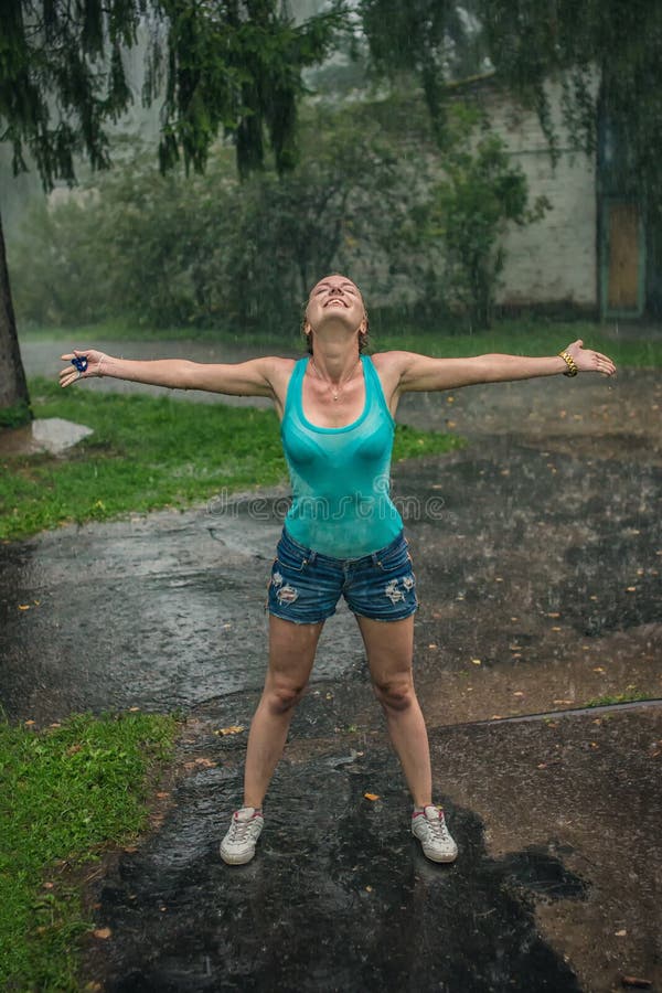 Warm summer rain stock image. Image of warm, woman, rain - 78115509