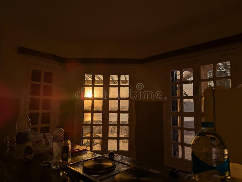 The Warm Sunset Glow Beautifully Illuminates the Kitchen Windows ...